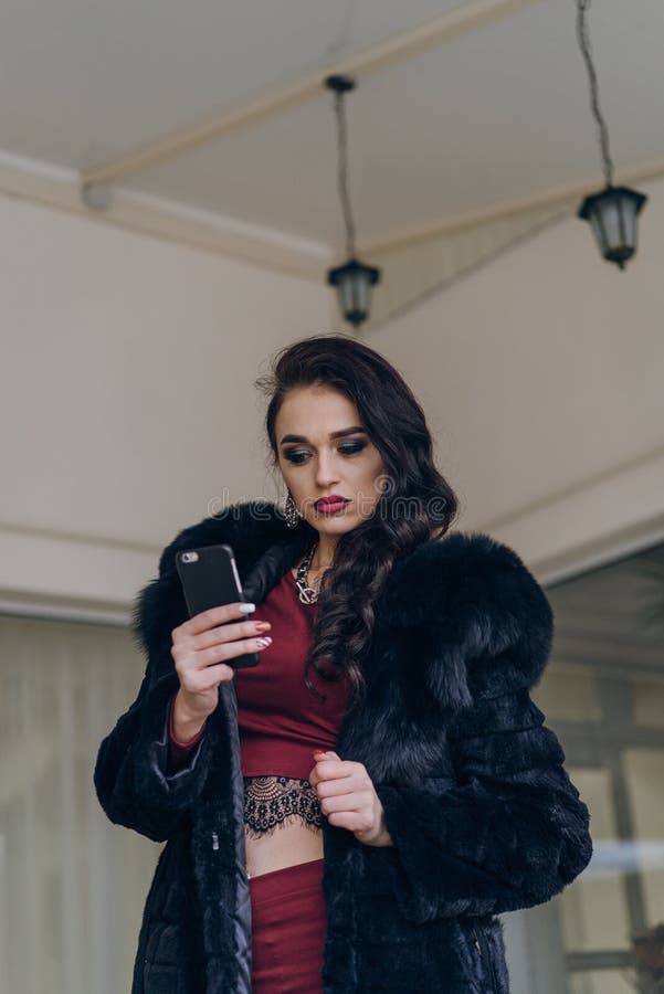 Elegant Model in Black Coat with Phone Stock Image - Image of beauty ...