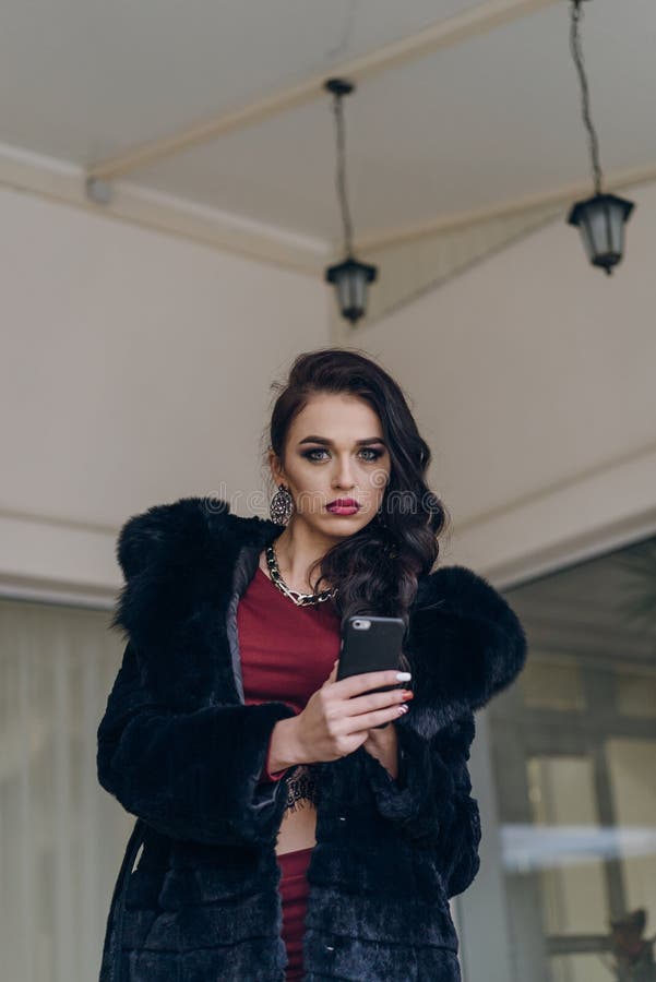 Elegant Model in Black Coat with Phone Stock Image - Image of brunette ...