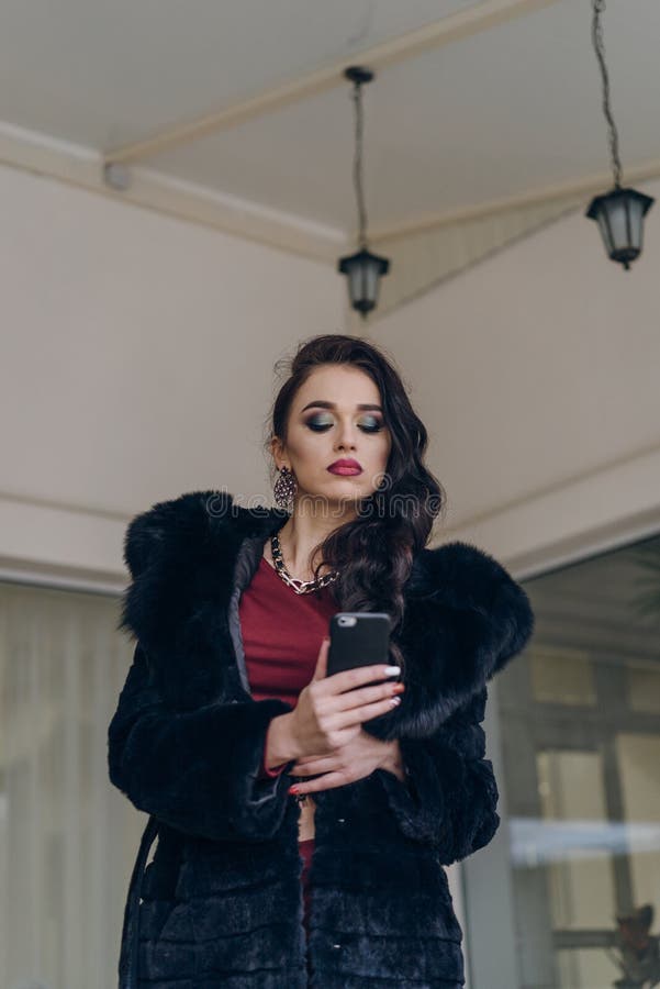 Elegant Model in Black Coat with Phone Stock Image - Image of elegance ...