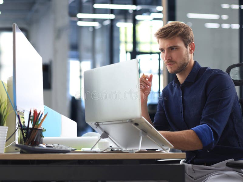 Elegant Modern Businessman Analyzing Data while Working in Office Stock ...