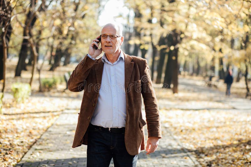 Elegant old men walking stock photo. Image of outdoors - 62492004