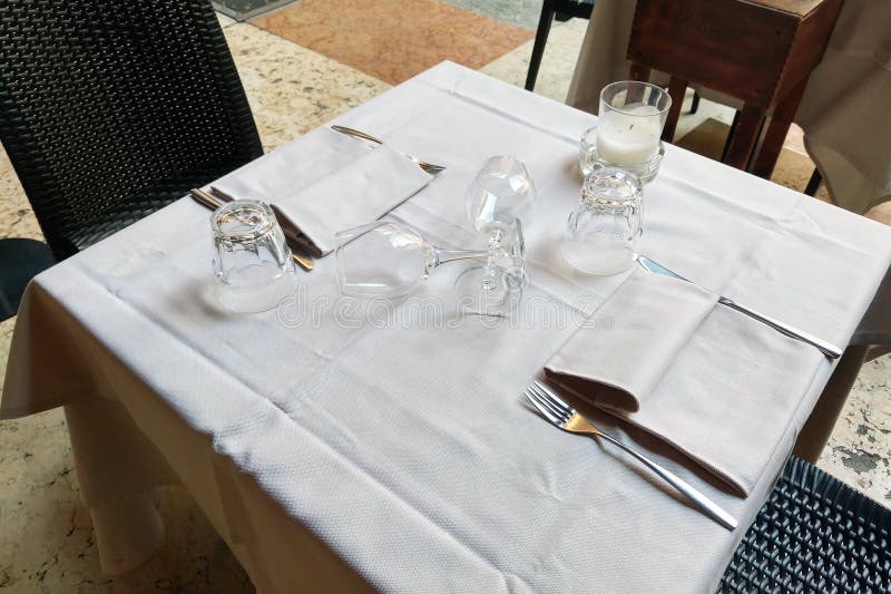 Elegant Table Setting with Upside-Down Glassware and Candle Decor in an ...