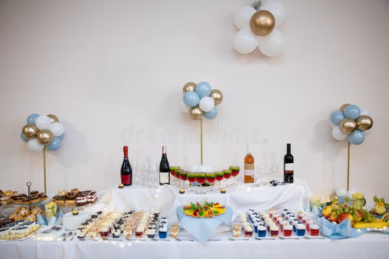 An Elegant Party Table Setup Featuring an Array of Delicious Treats ...