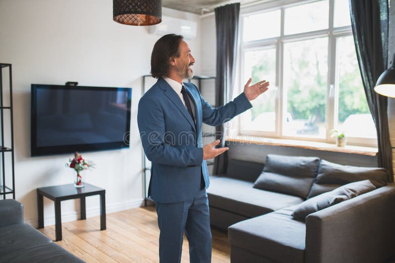 Elegant Real Estate Agent Presenting Apartment for Rent Stock Image ...