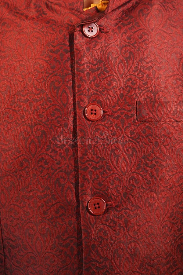 Elegant Red Fabric with Intricate Pattern and Unique Buttons Stock ...