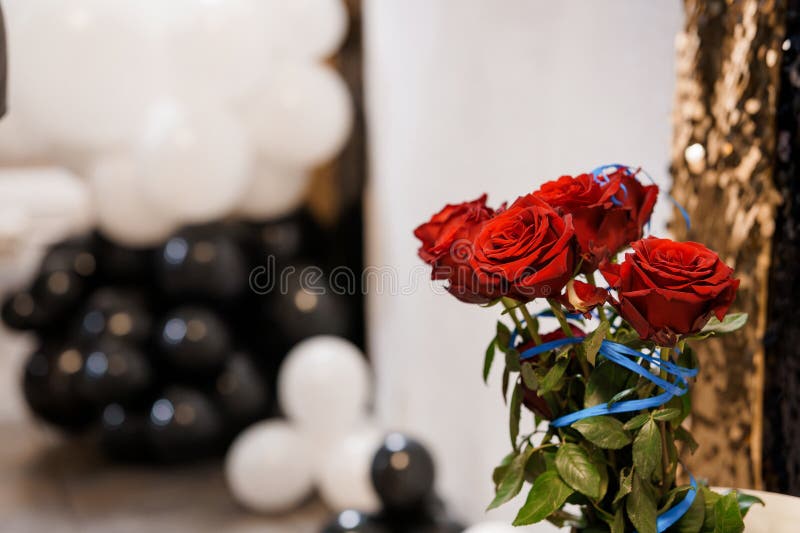Elegant Red Roses with Balloons in a Festive Setting Stock Image ...