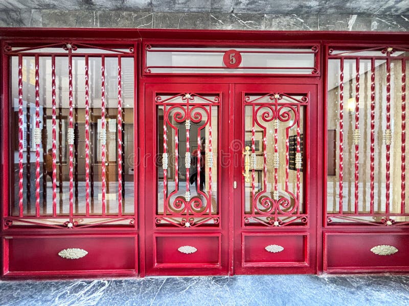 Elegant Red Storefront with Intricate Designs and Decorative Elements ...