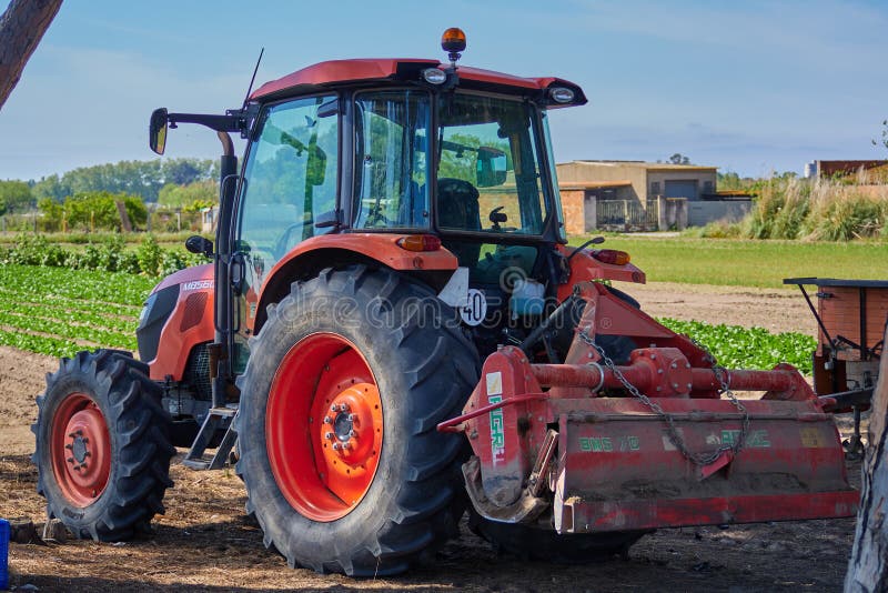 Elegant Red Tractor with Cutter on the Field Editorial Photography ...