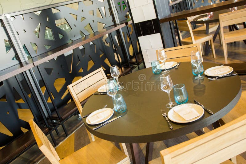 Elegant Restaurant Table with Cutlery, Crockery and Glasses. Stock ...
