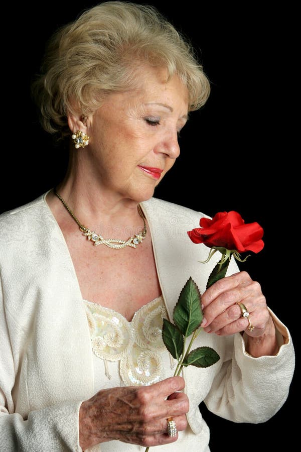 Elegant Senior Holds Rose stock image. Image of elegant - 1069225