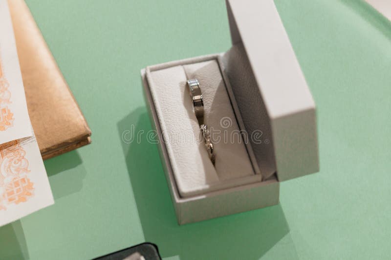 Elegant Silver Ring in Gift Box on Celebratory Green Background Stock ...