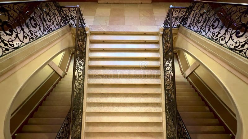 An Elegant Staircase with Beautiful Decorative Railings in a Luxurious ...