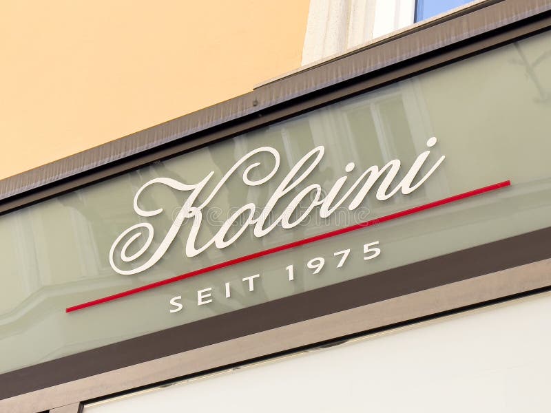 Elegant Storefront Signage with Script Logo and Historical Date Display ...