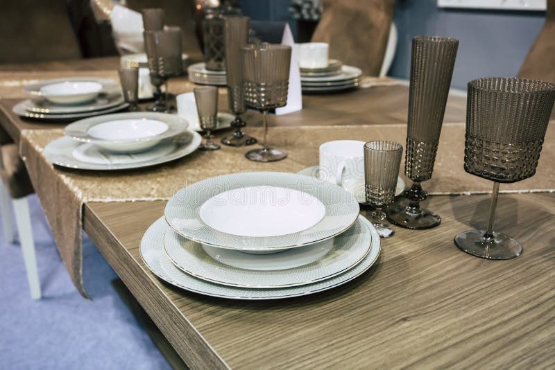 Elegant Table Appointments with Classic Plates and Retro Glasses Ready ...