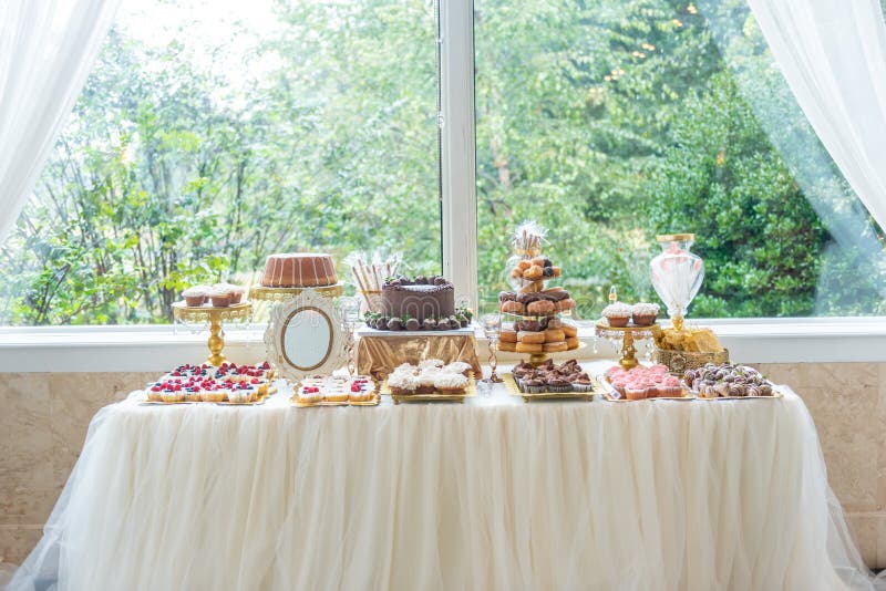 Elegant Table with Delicious Desserts in Front of a Window Stock Image ...