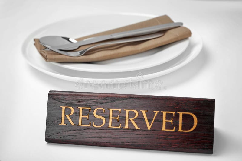 `Reserved` Sign On Dining Table In Restaurant With Spoon, Fork And ...