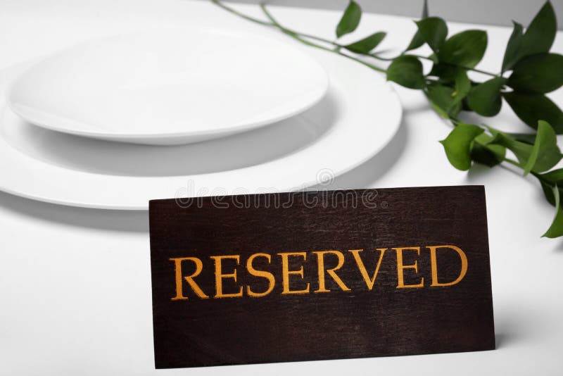 Elegant Table Setting and RESERVED Sign in Restaurant Stock Photo ...
