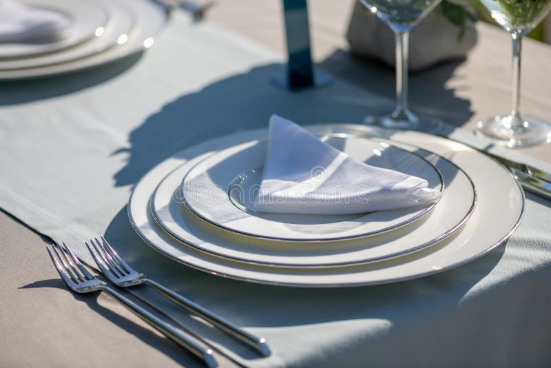 Elegant Table Setting with White Plates in a Restaurant Outdoor Stock ...