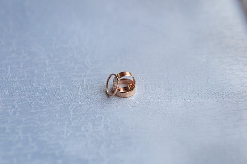 Elegant Twin Wedding Rings on Soft Blue Background Stock Photo - Image ...