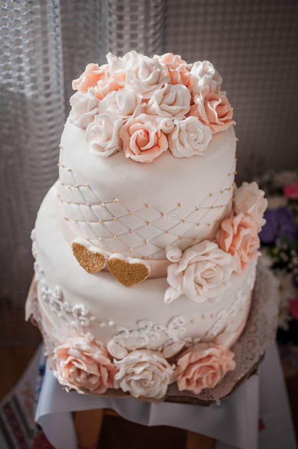 Elegant Two-Tiered Wedding Cake Adorned with Delicate Sugar Roses Stock ...