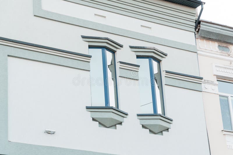 Elegant Vintage Facade with Modern Windows Accentuated by Soft Colors ...
