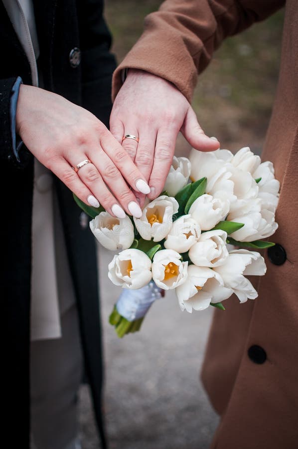 Elegant Wedding Hands with White Tulips and Rings Stock Photo - Image ...
