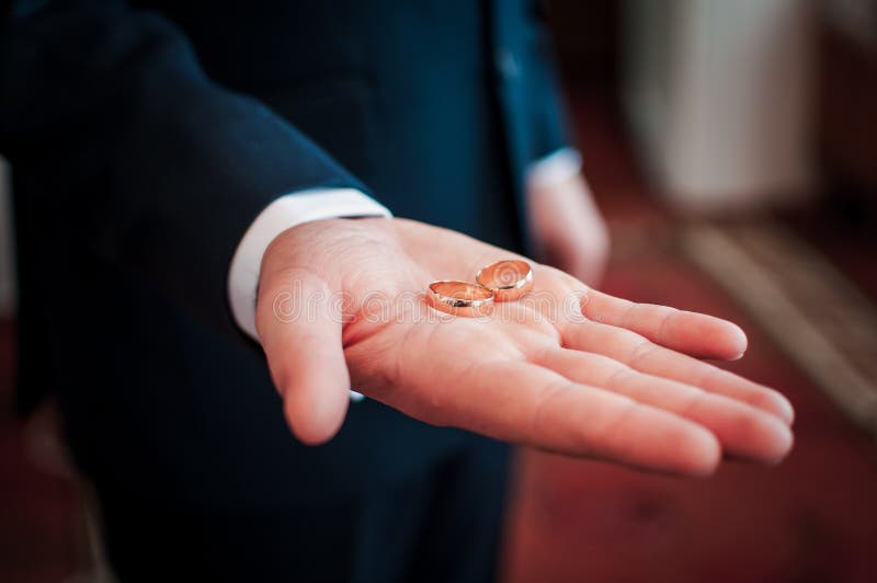 Elegant Wedding Rings Held in a Gentleman& X27;s Hand Stock Image ...