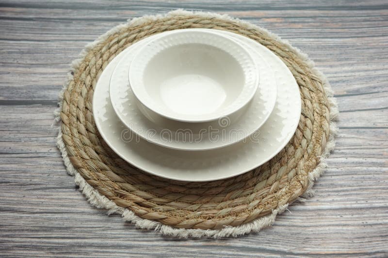 An Elegant White Dinnerware Set Displayed Beautifully on a Rustic Table ...