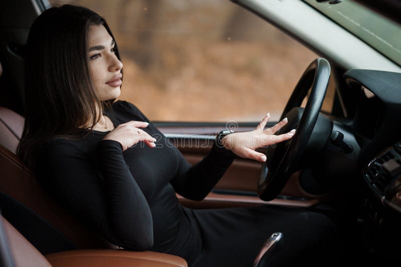 Elegant Woman Posing in Luxury Car Interior Stock Photo - Image of ...