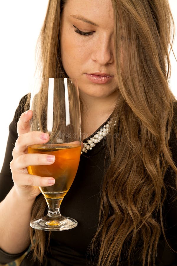 Elegant Young Female Model Holding Drink Looking Down Stock Photos ...