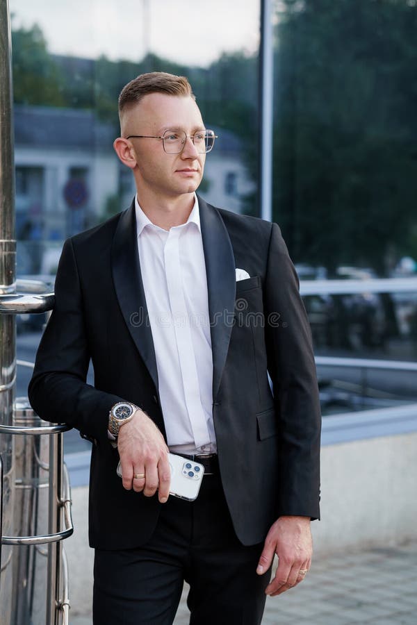 Elegant Young Man in Tailored Suit Against Urban Backdrop Stock Photo ...