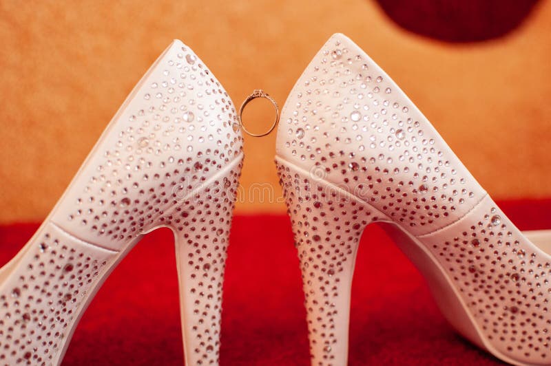 Elegantly Adorned White High Heels with a Sparkling Engagement Ring ...