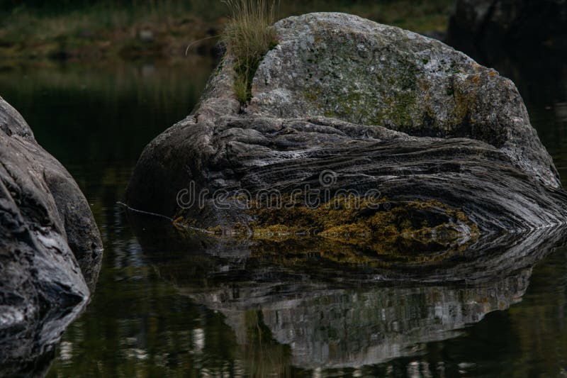 Elemental Reflection: Stone and Its Water Mirror Stock Image - Image of ...