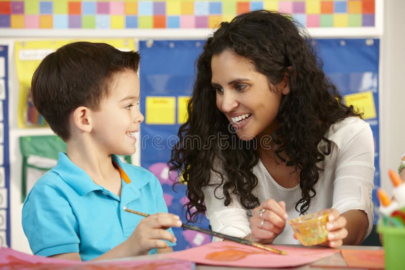 Elementary Age Pupil in Art Class with Teacher Stock Image - Image of ...