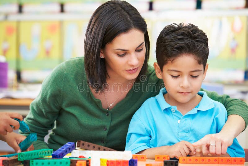 Elementary Pupil Counting with Teacher in Classroom Stock Photo - Image ...