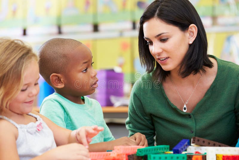 Elementary Pupil Counting with Teacher in Classroom Stock Photo - Image ...