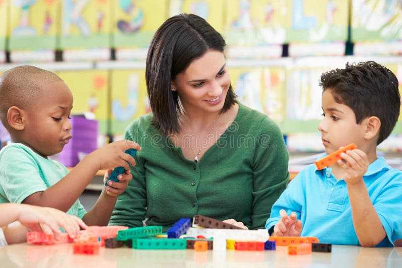 Elementary Pupils Counting with Teacher in Classroom Stock Photo ...