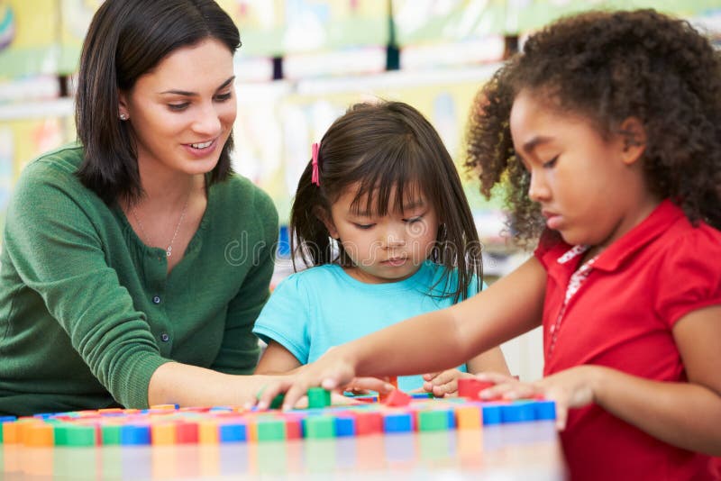 Elementary Pupils Counting with Teacher in Classroom Stock Image ...