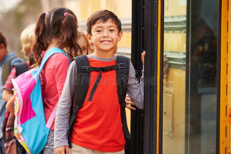Elementary School Boy at the Front of the School Bus Queue Stock Photo ...
