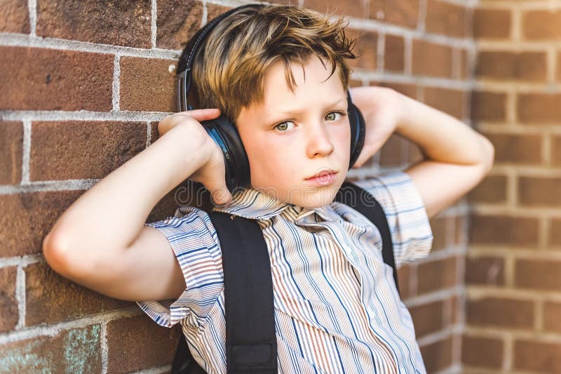 Elementary School Boy Outside Carrying a Backpack Stock Image - Image ...