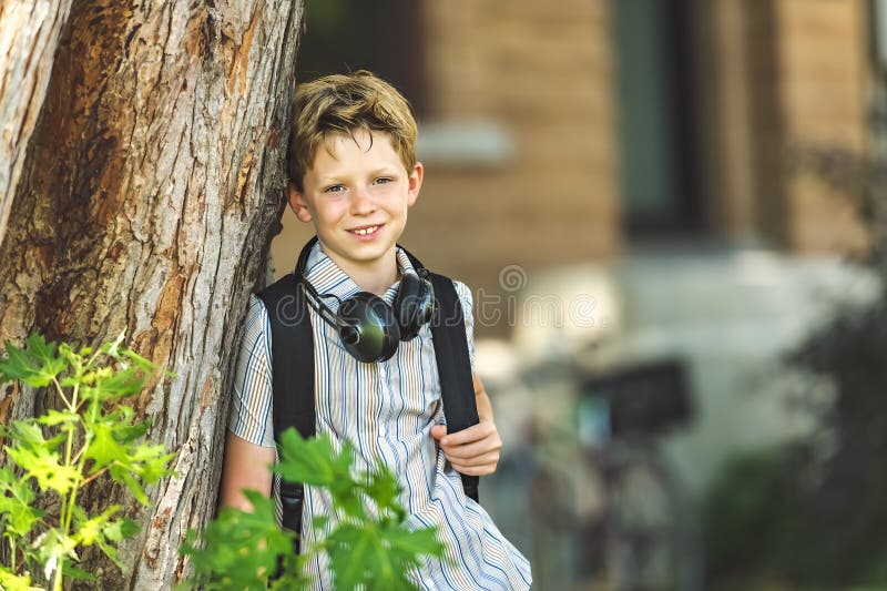 Elementary School Boy Outside Carrying a Backpack Stock Image - Image ...