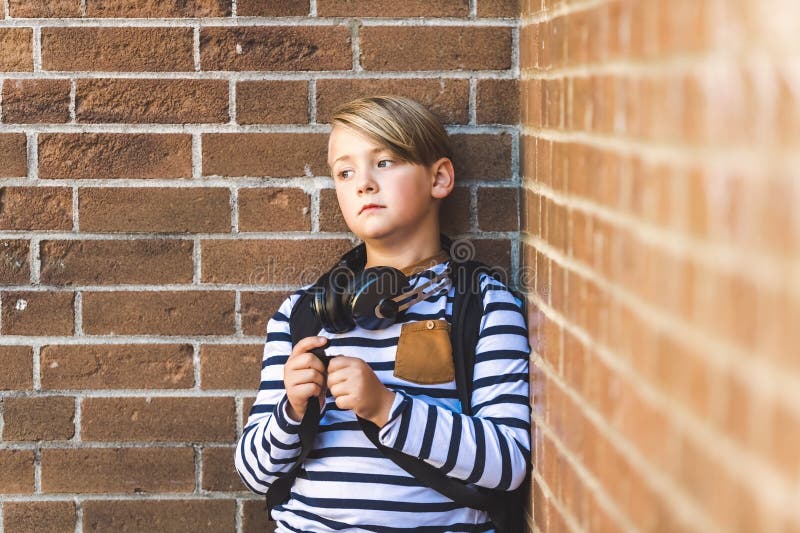 Elementary School Boy Outside Carrying a Backpack Stock Photo - Image ...
