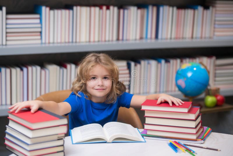 Elementary School Boy. School Boy Reading Book in Library. Kids ...
