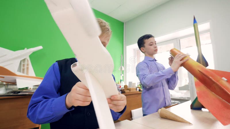 Elementary School Boys Assembling Constructor Models of the Plane and ...