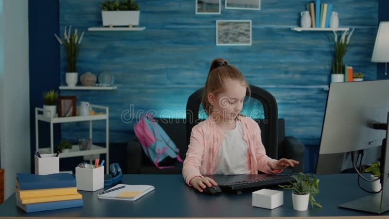 Elementary School Child Using Computer and Keyboard Stock Footage ...