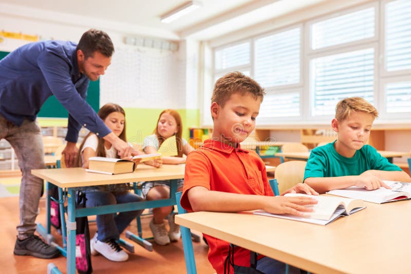 Elementary School Children Studying in Class Stock Photo - Image of ...