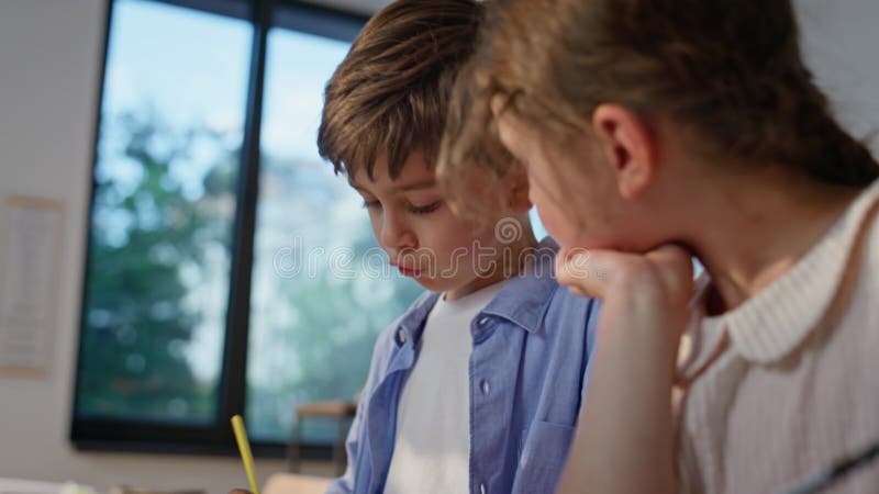 Elementary School Classmates Working Together at Lesson Closeup. Two ...
