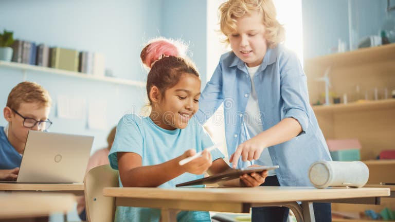 Elementary School Computer Science Class: Smart Girl Uses Digital ...