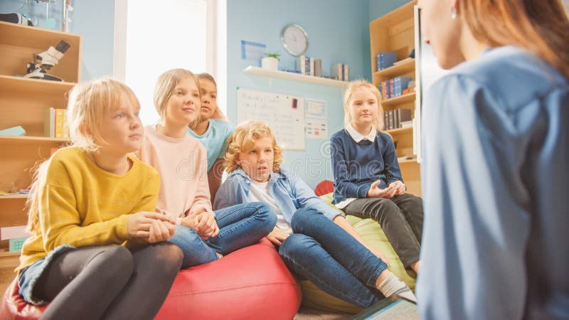 Elementary School Creativity Class: Children Sitting on the Carpet ...
