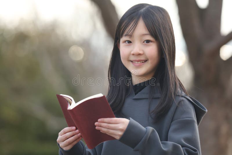 Elementary School Girl Reading a Book Stock Photo - Image of woman ...